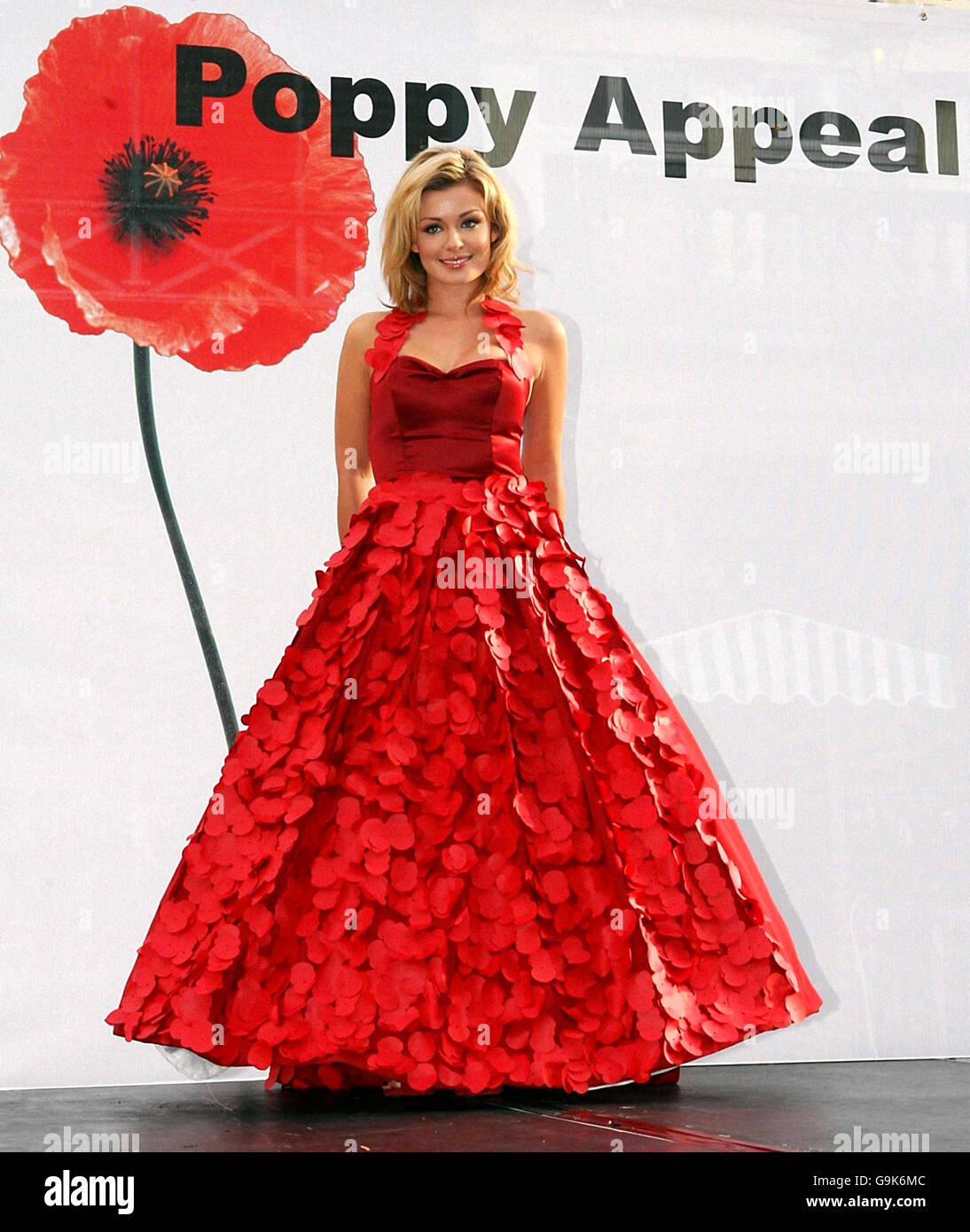 Singer Katherine Jenkins wears a dress made up of 2,500 poppies as she ...