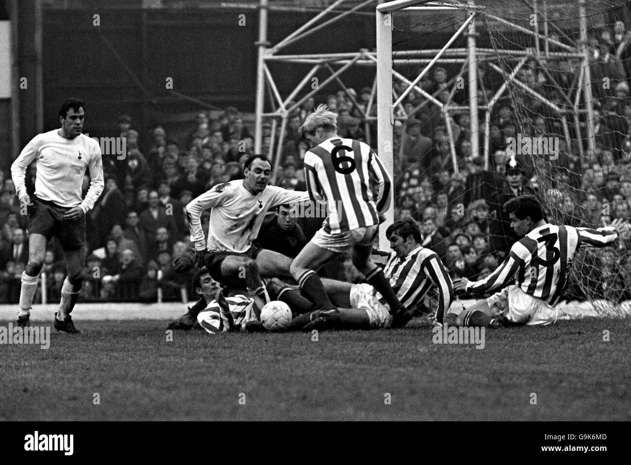 Tottenham Hotspur's Mike England (l) looks on as teammate Alan Gilzean ...