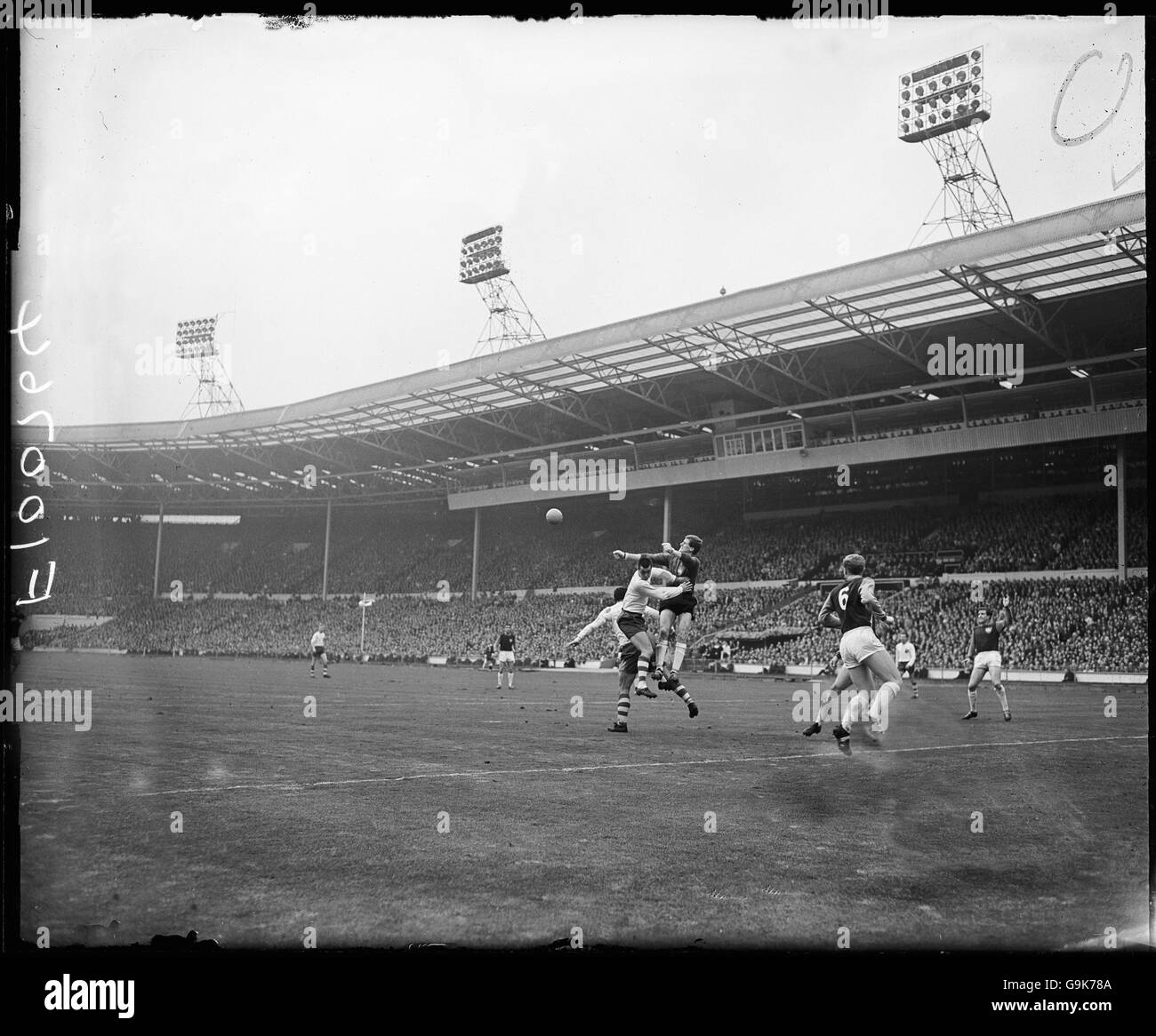 West ham uniteds jim standen c punches clear under pressure hi-res ...