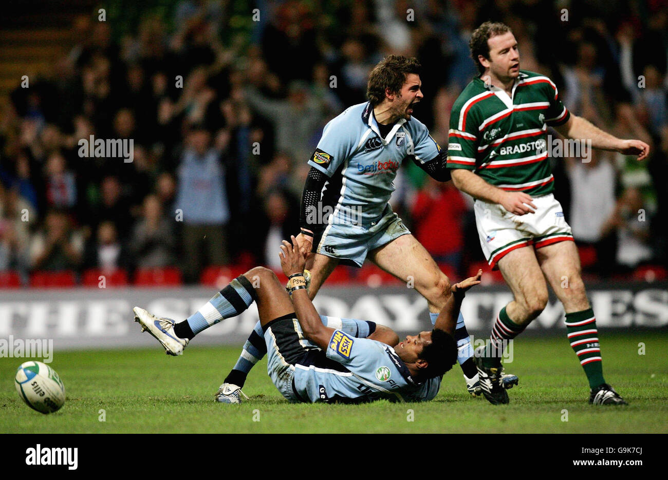 Cardiff's Nicky Robinson (standing) celebrates the opening try against ...