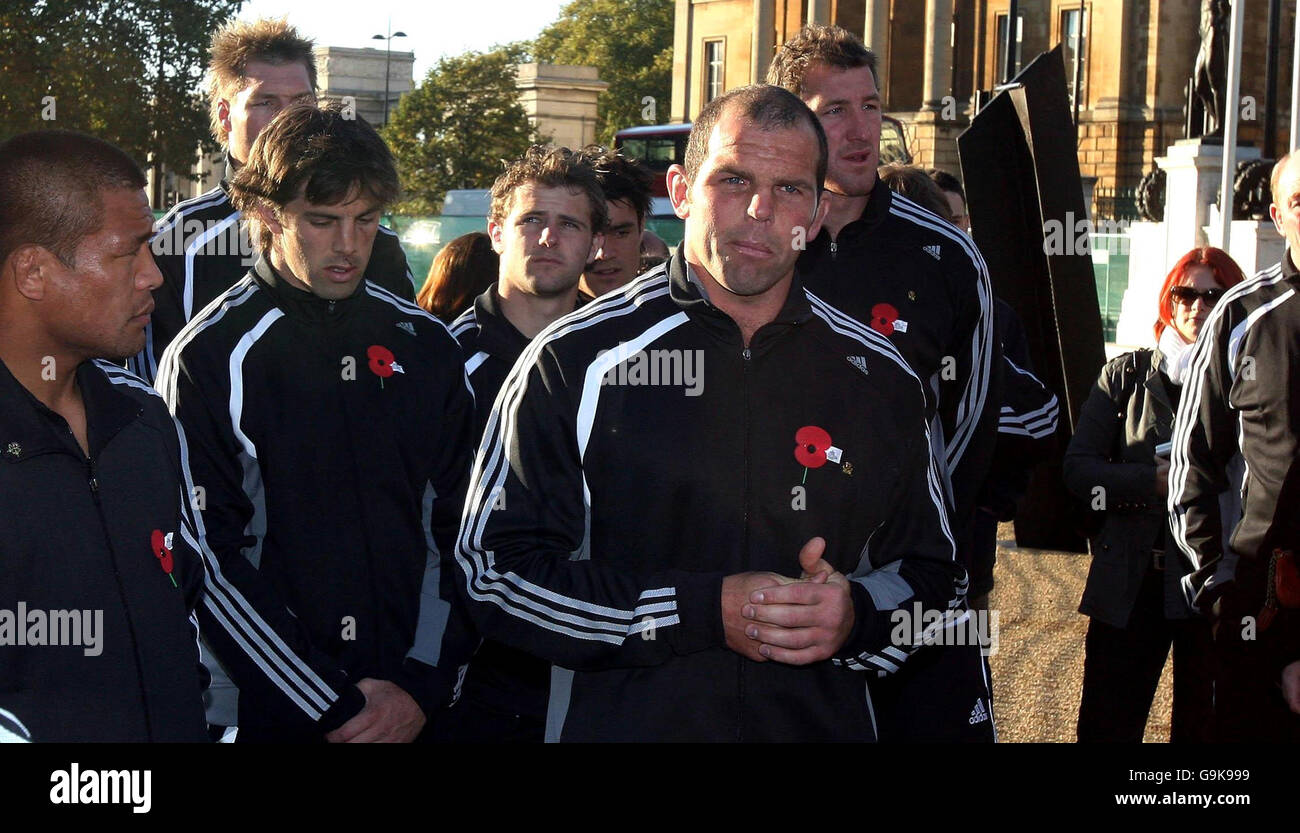 New Zealand All Blacks rugby player Anton Oliver (centre) talks to the ...