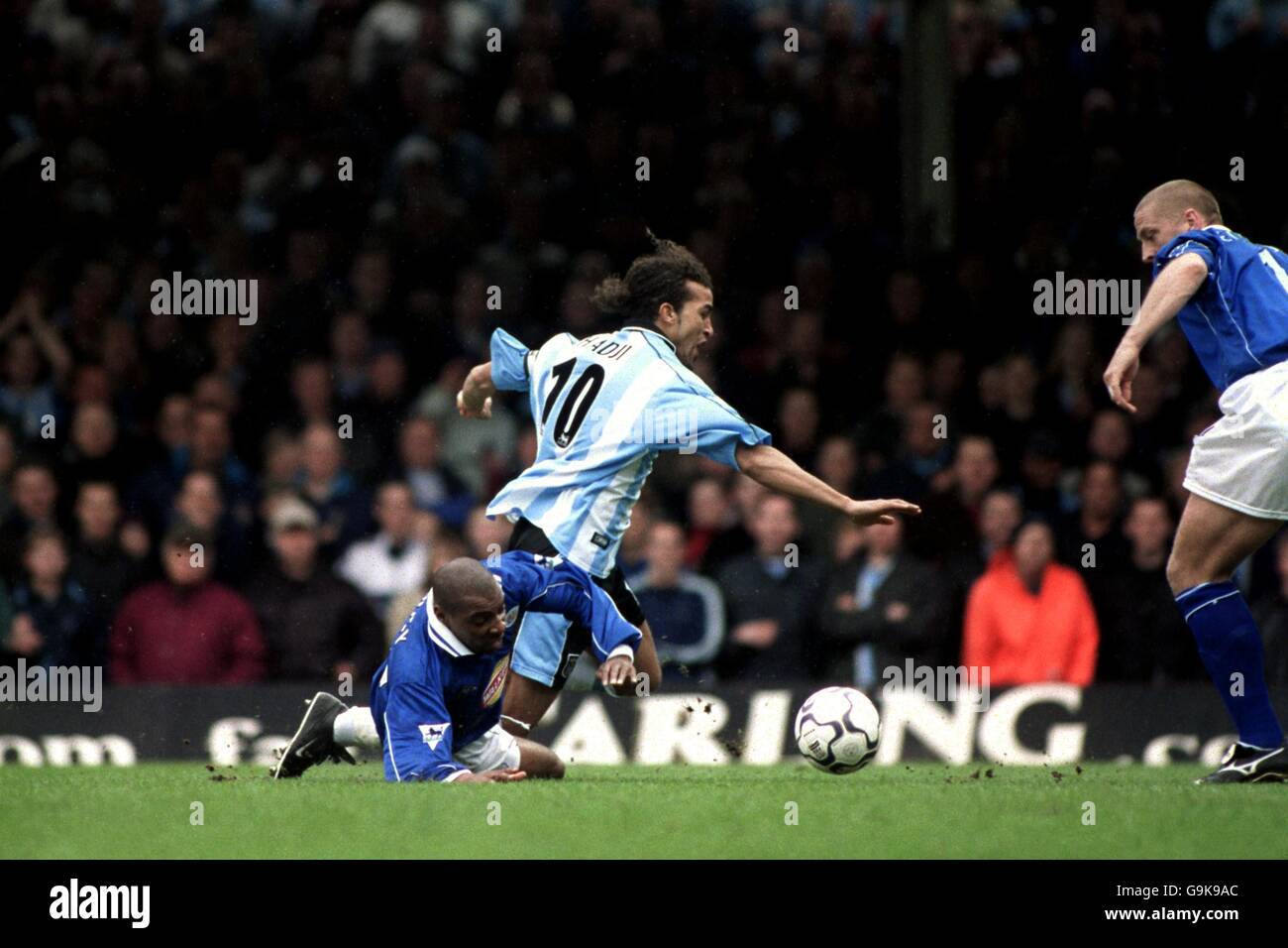 Coventry City's captain Mustapha Hadji is brought down by a challenge ...
