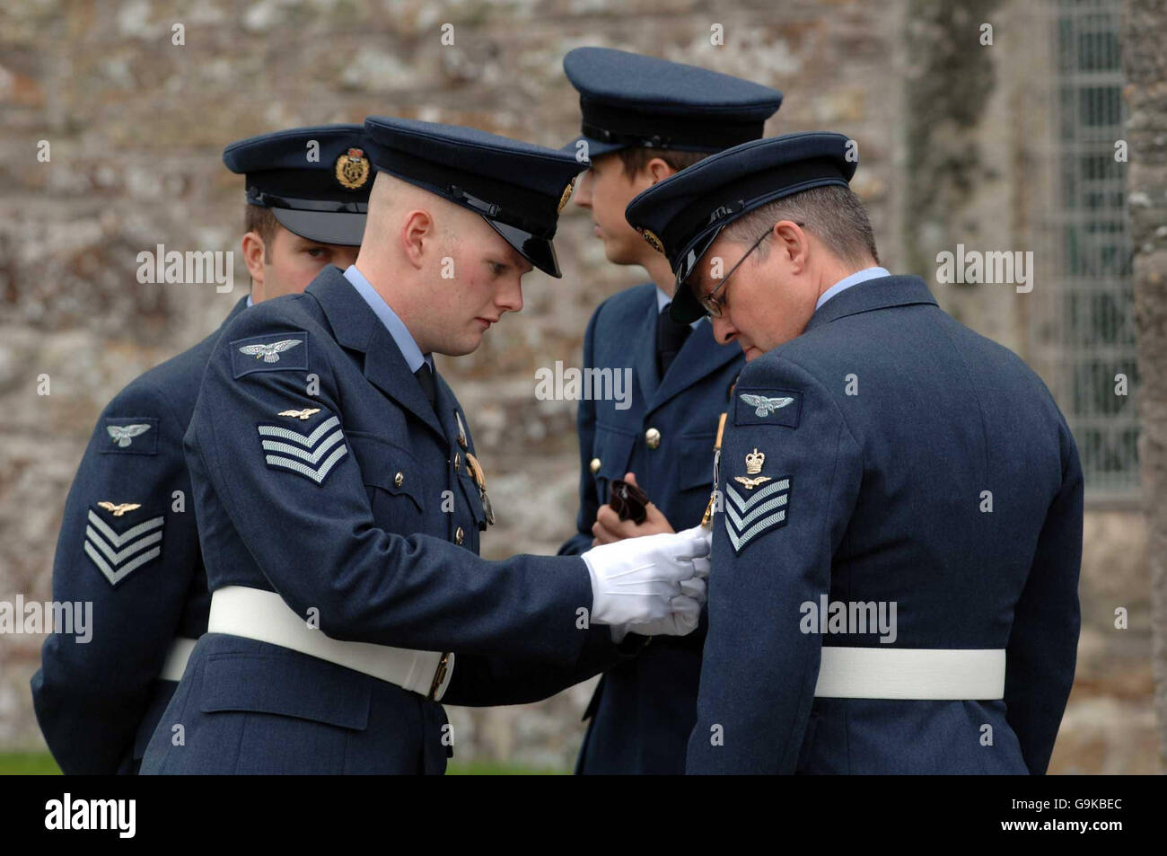 Fellow RAF personnel support each other at the funeral of Ft Lt Gareth ...
