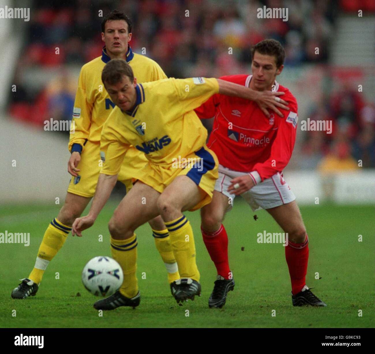 Nottingham forests williams is held off by gillinghams mark patterson ...
