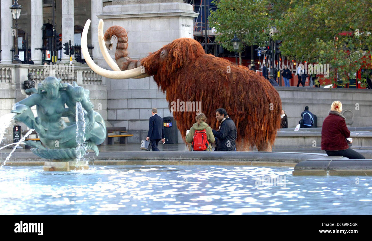 Mammoth warns of global change. A life-size woolly mammoth sits in ...