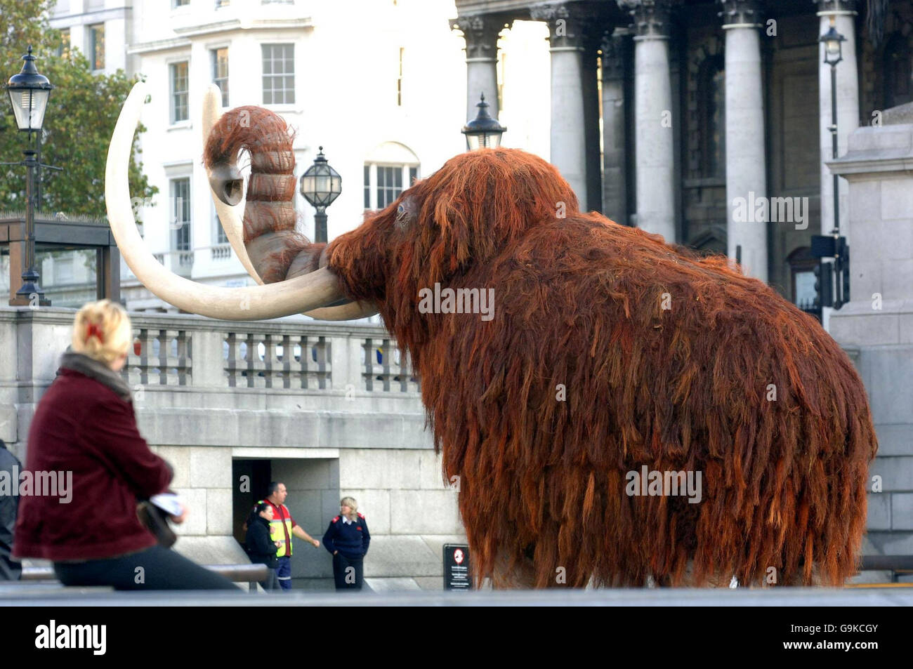 Mammoth warns of global change. A life-size woolly mammoth sits in ...