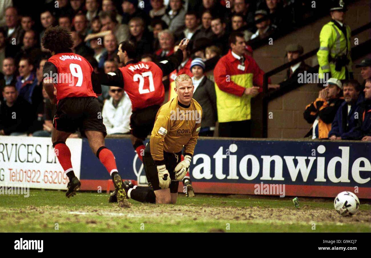Walsall's Pedro Matias runs away to celebrate scoring the opening goal ...