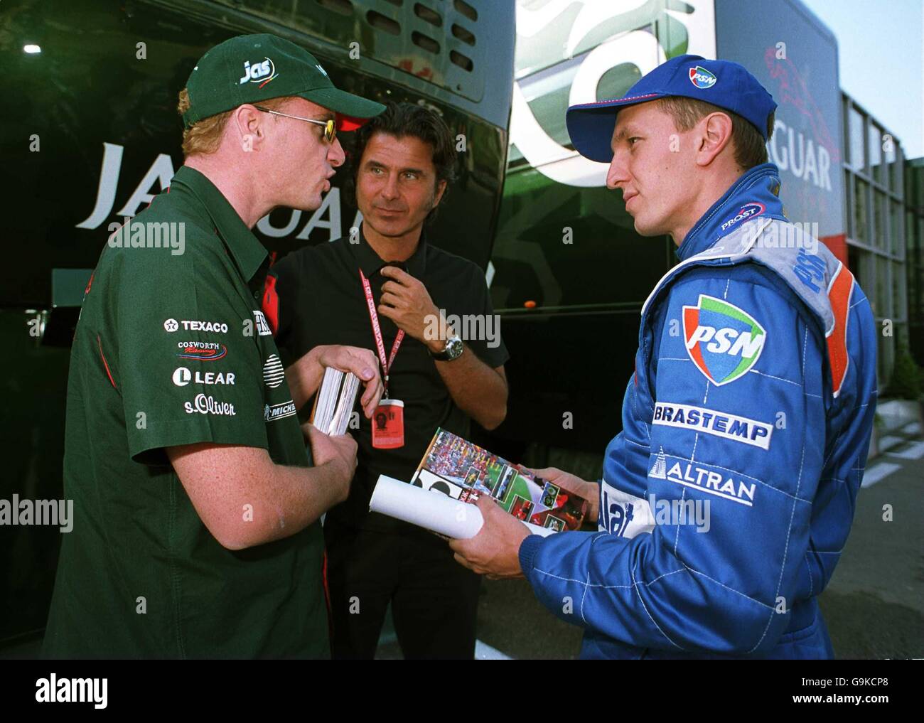 Eddie Irvine gives former Jaguar team mate Luciano Burti some advice ...
