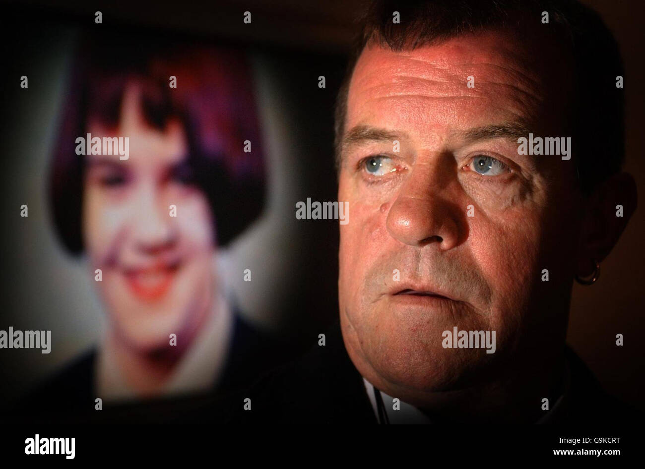 Michael Hamilton with a TV displaying an image of his missing daughter ...