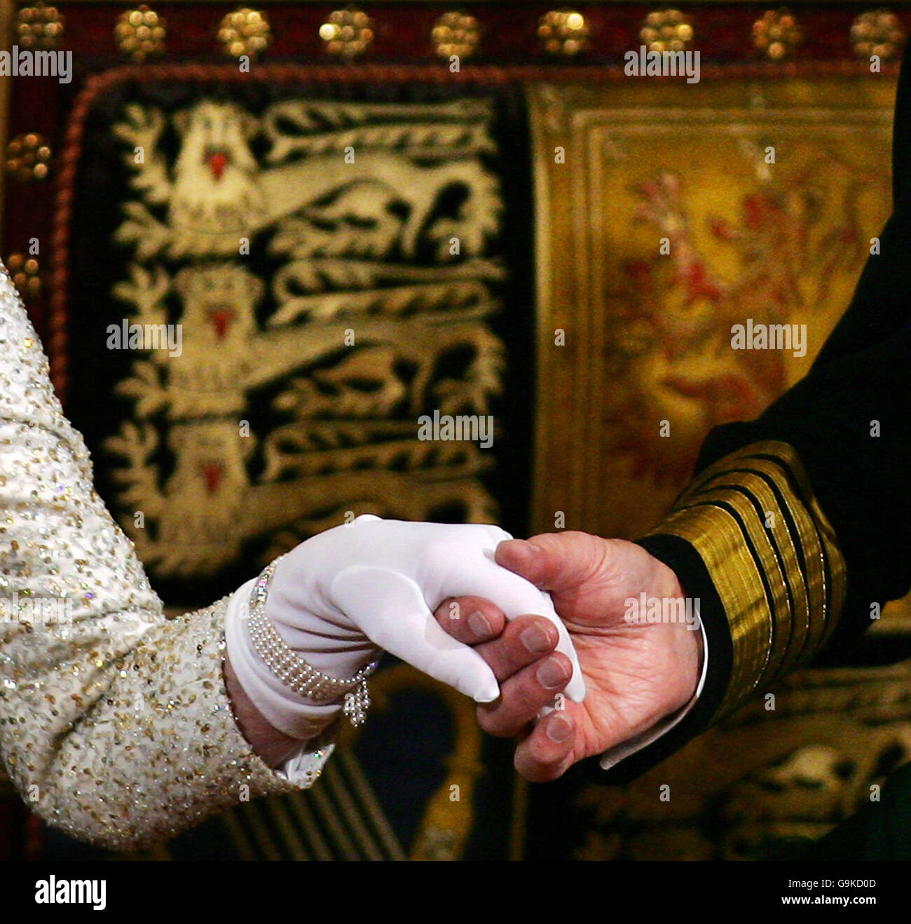 Britain's Duke of Edinburgh (right) holds the Queen's hand as she steps ...