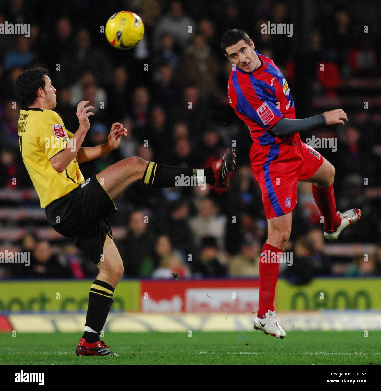 Barnsley's Daniel Nardiello (left) and Palace's Mark Hudson battle for ...