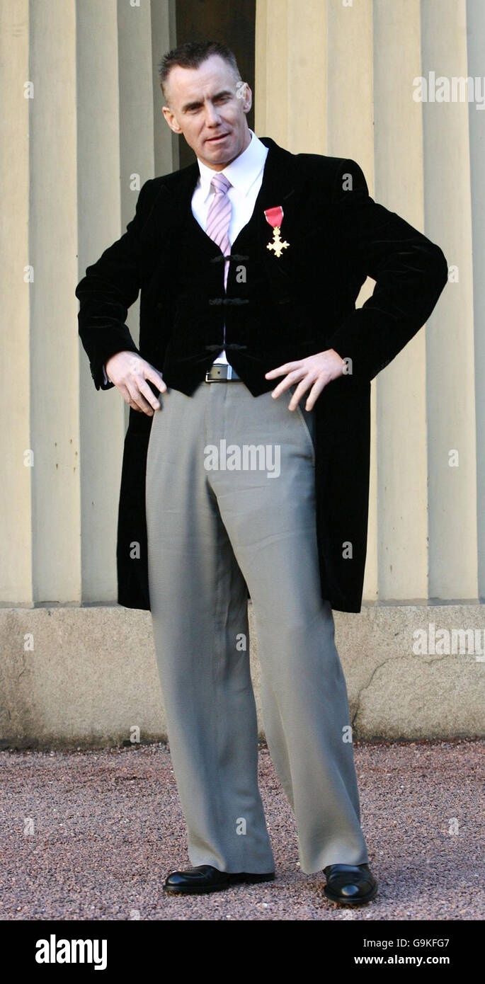 Chef Gary Rhodes proudly shows off his OBE awarded for services to the ...