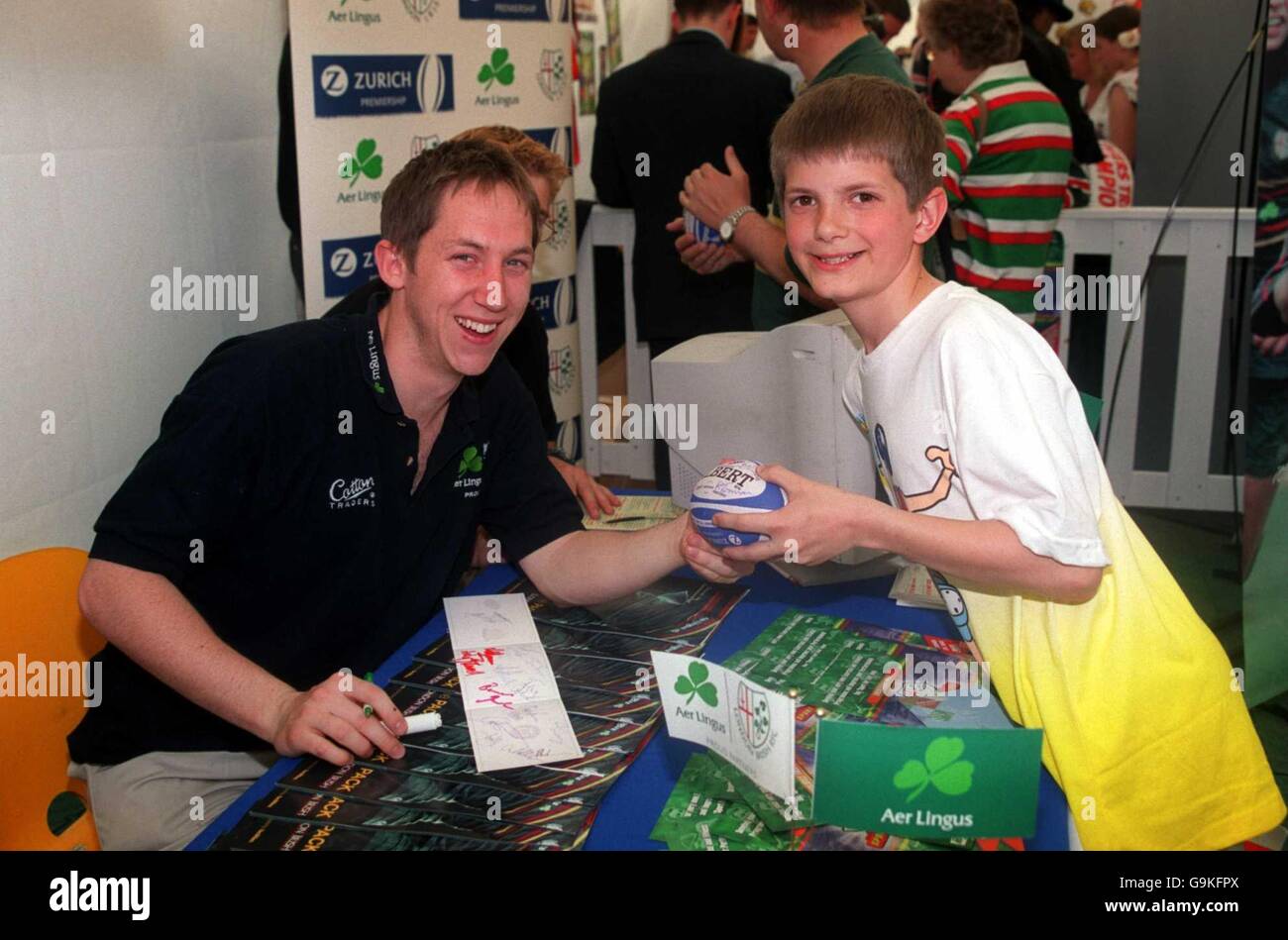 London Irish's Kevin Brennan signs a mini Gilbert rugby ball for a ...