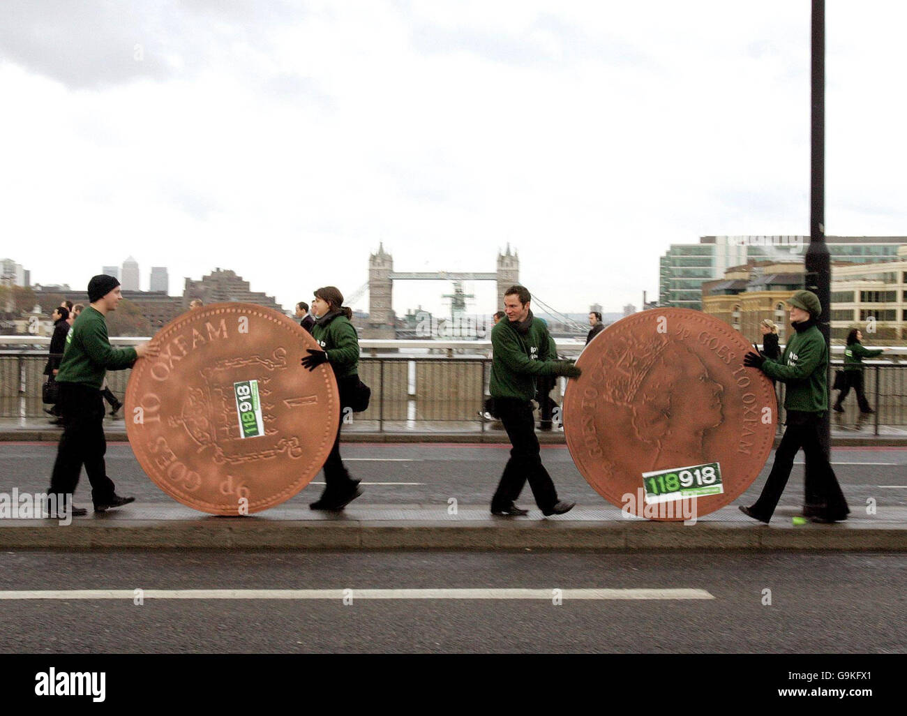 Giant penny coins are rolled over London Bridge to launch a new ...