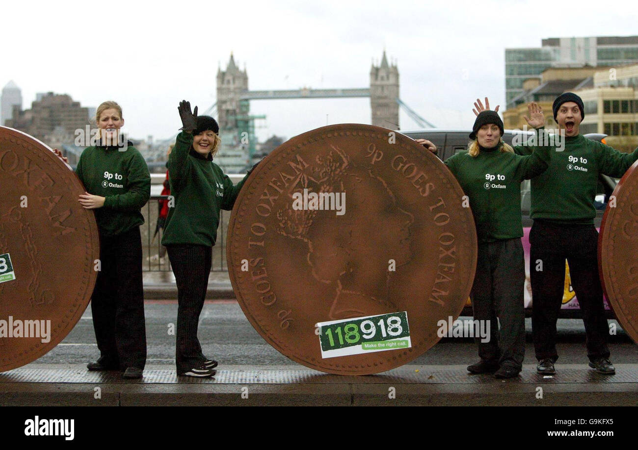Giant penny coins are rolled over London Bridge to launch a new ...
