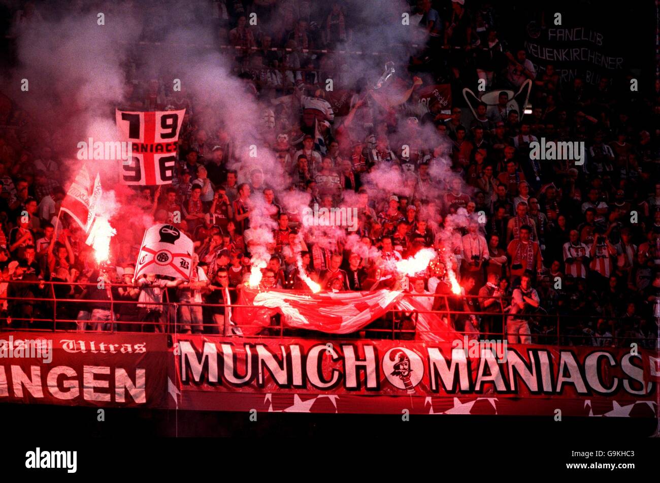 Bayern munich fans light flares while cheering on their team hi-res ...