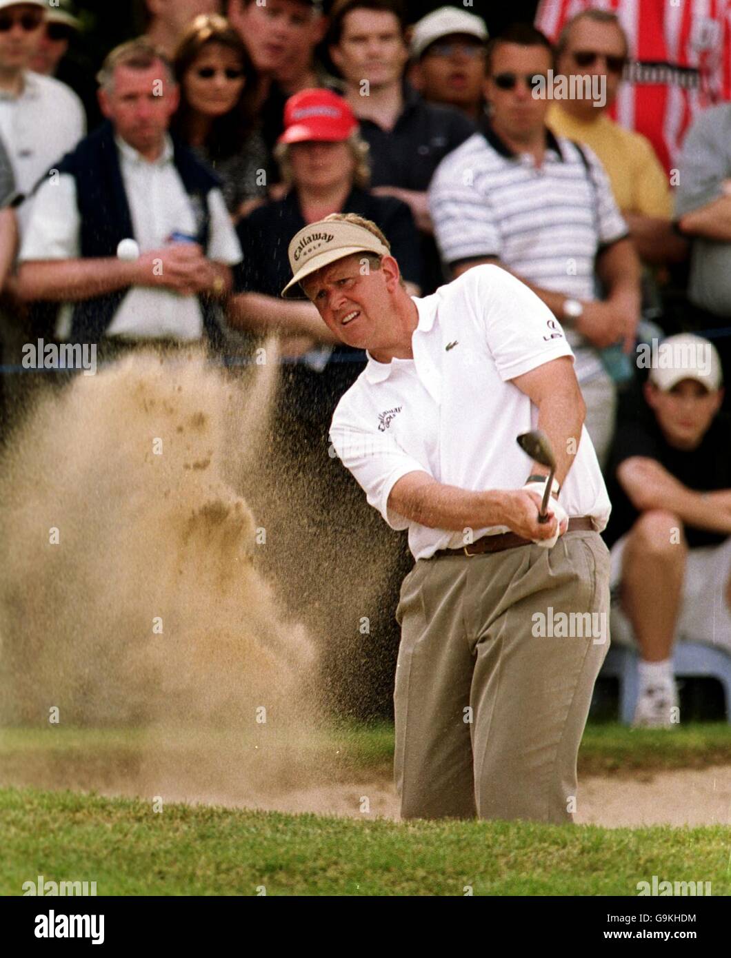 Colin montgomerie plays out of a bunker hi-res stock photography and ...