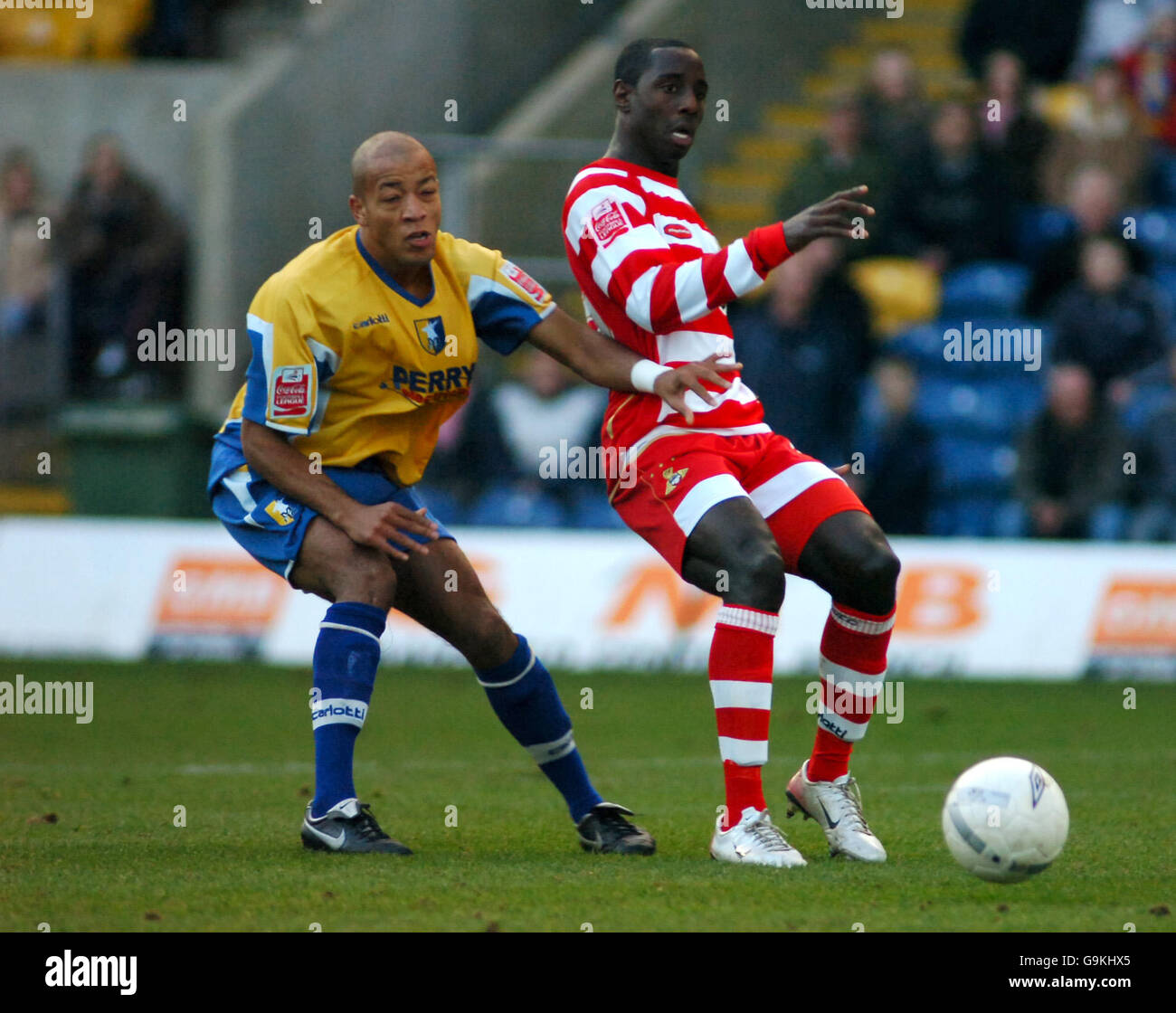 Mansfield Town's Jonathan D'Laryea and Doncaster Rovers' Jonathon Forte ...