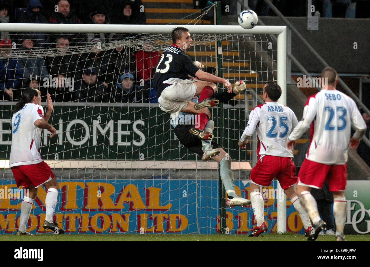 Kevin Twaddle of Falkirk crashes into Rangers goal keeper Allan ...