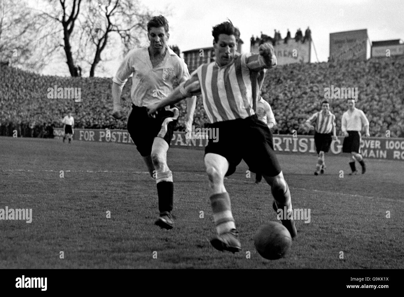 Sunderland's Len Shackleton (r) prepares to cross the ball as he is ...