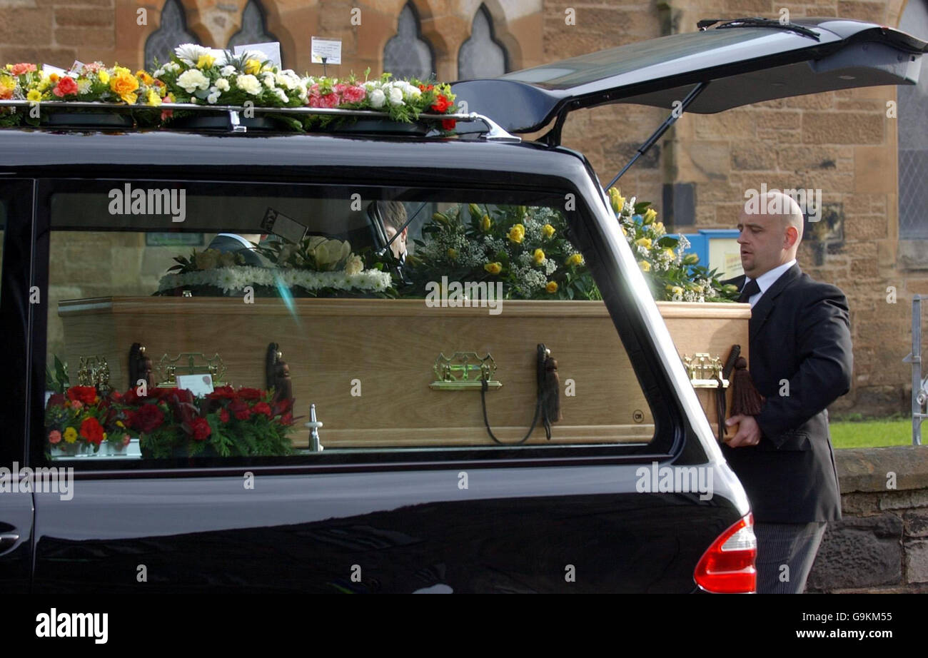 The coffin of dead trawlerman Edward Gardner is pushed into a hearse ...