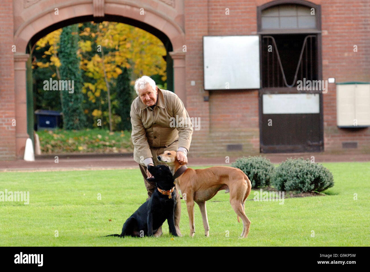 David Elsworth trainer of Desert Orchid with his two dogs Archie and ...