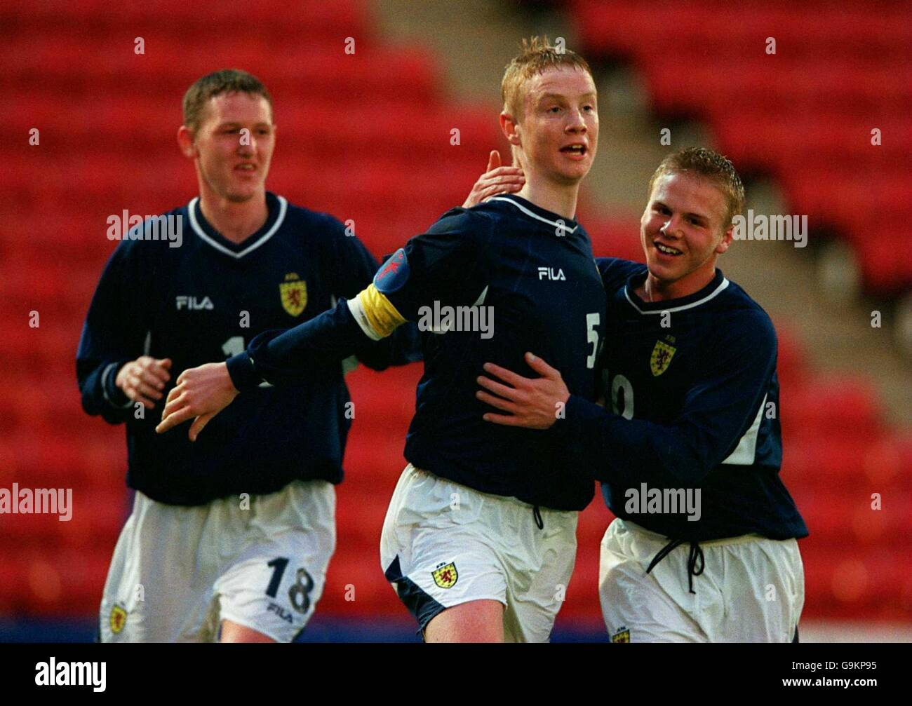 Scotland's Paul McLaughlin (c) is congratulated on scoring the second ...