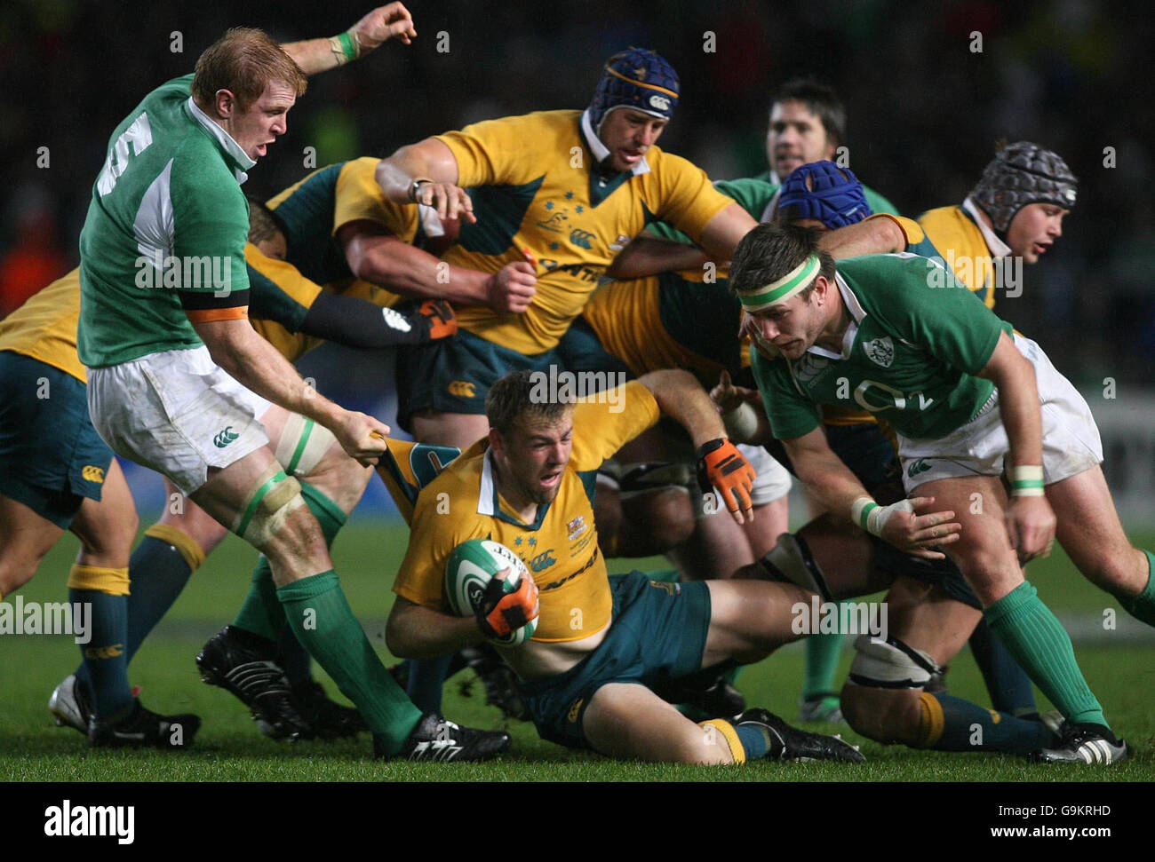 Australia's Chris Latham is surrounded by Ireland's defence including ...