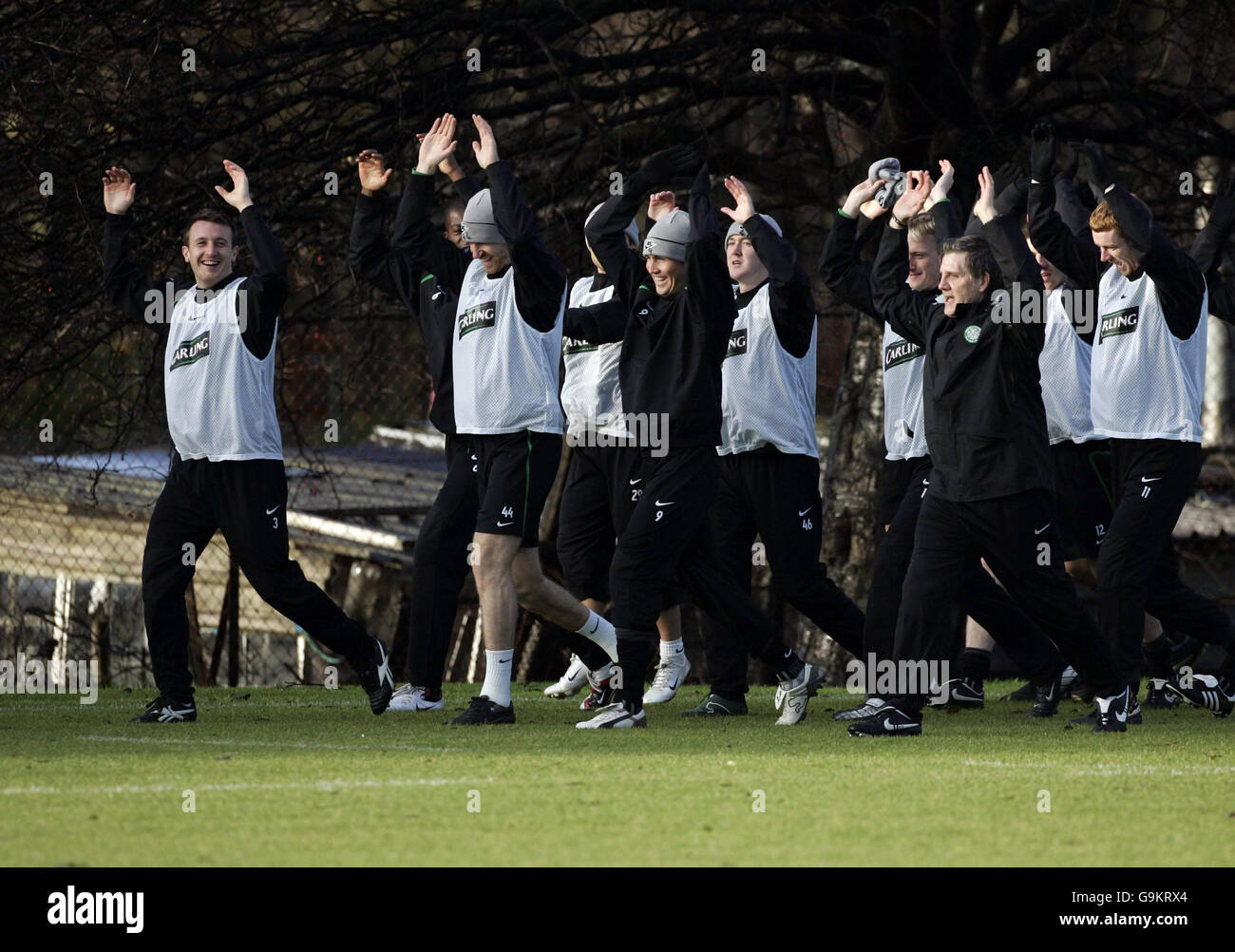 Celtic players warm up during the training session at Barrowfield ...
