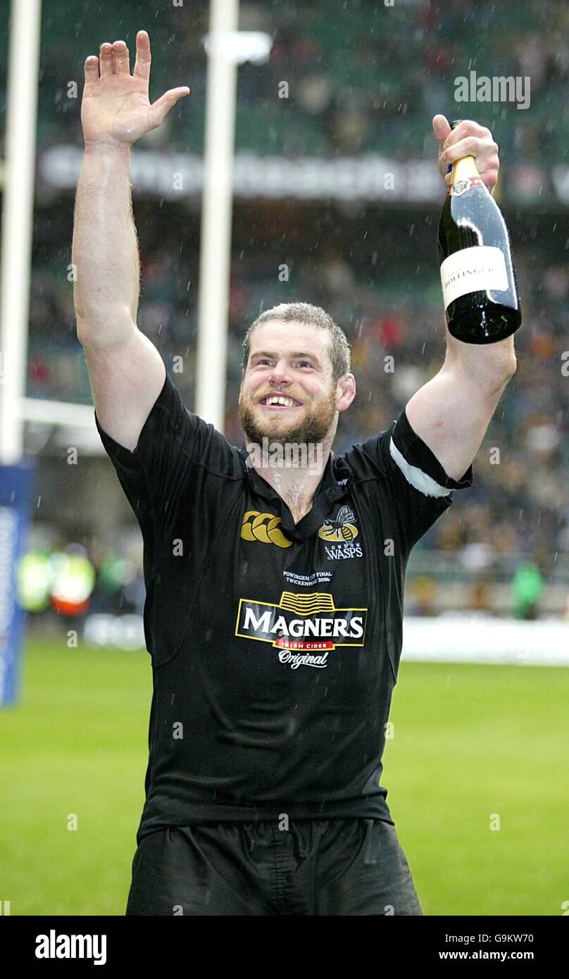 Wasps Peter Bracken waves to the fans as he celebrates the Powergen Cup ...