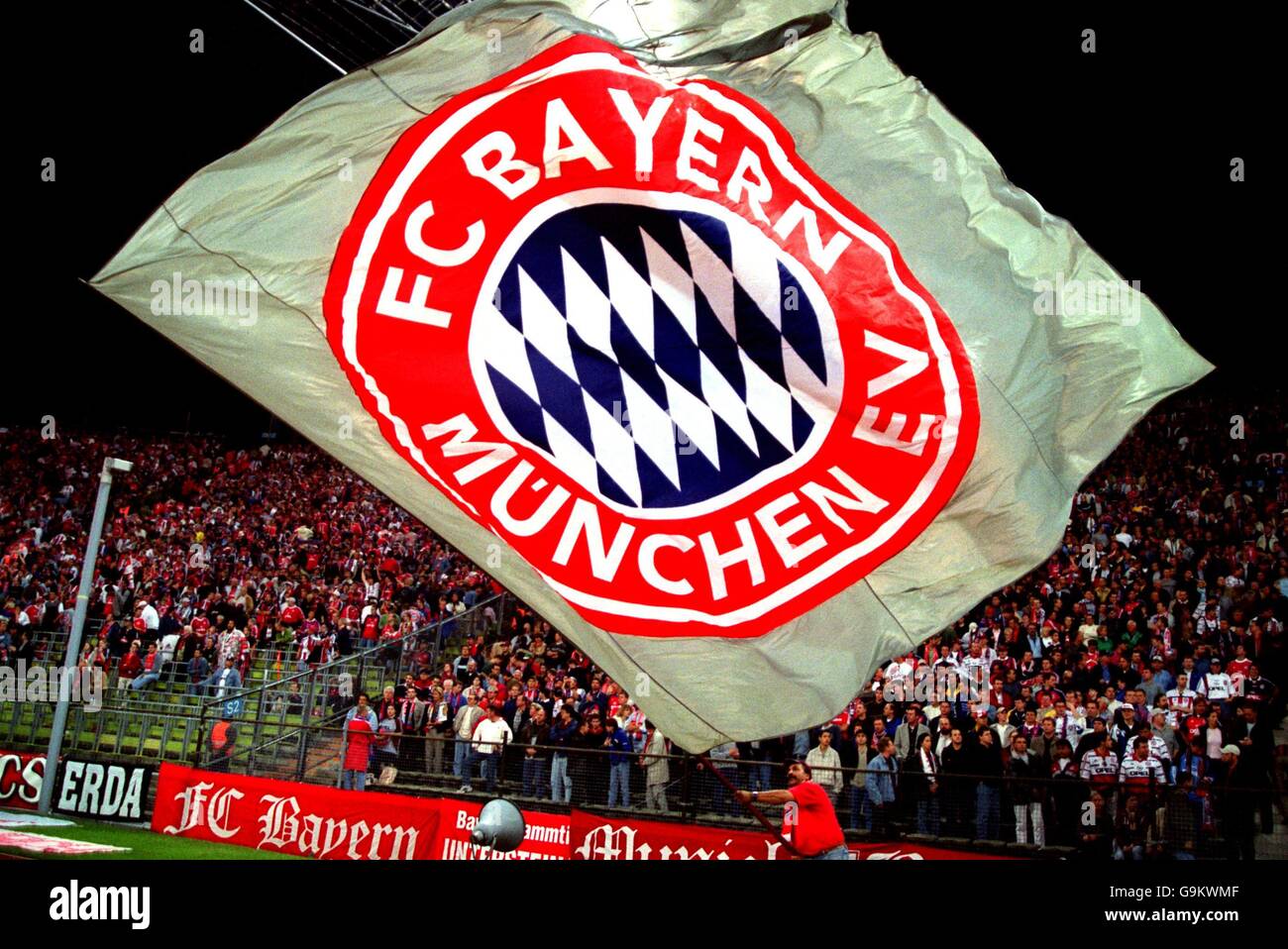 The fans wave a giant bayern munich flag hi-res stock photography and ...