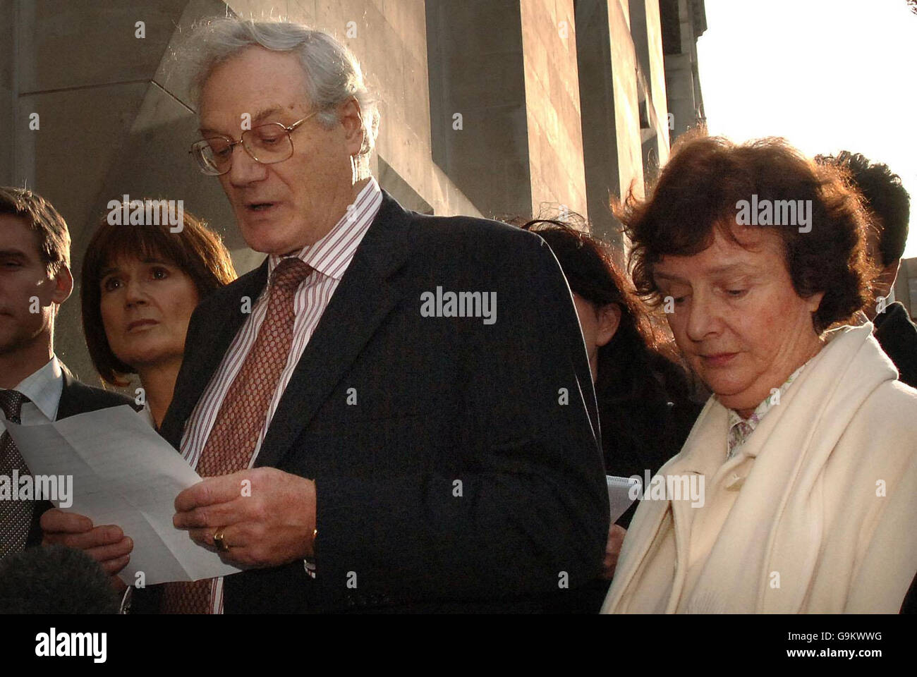 John ap Rhys Pryce reads a family statement while wife Estelle listens ...