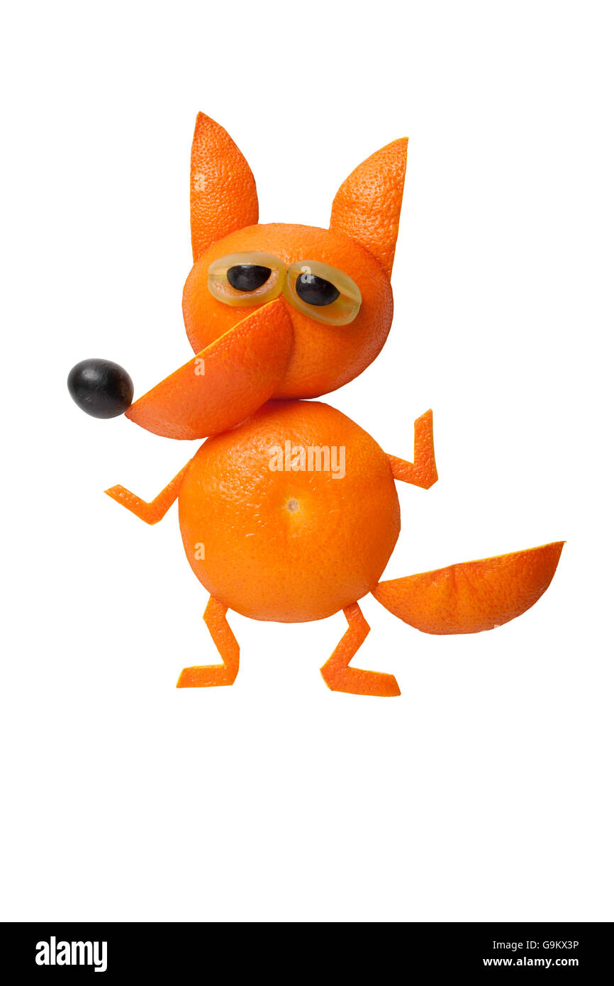 Dancing fox made of oranges on isolated background Stock Photo - Alamy