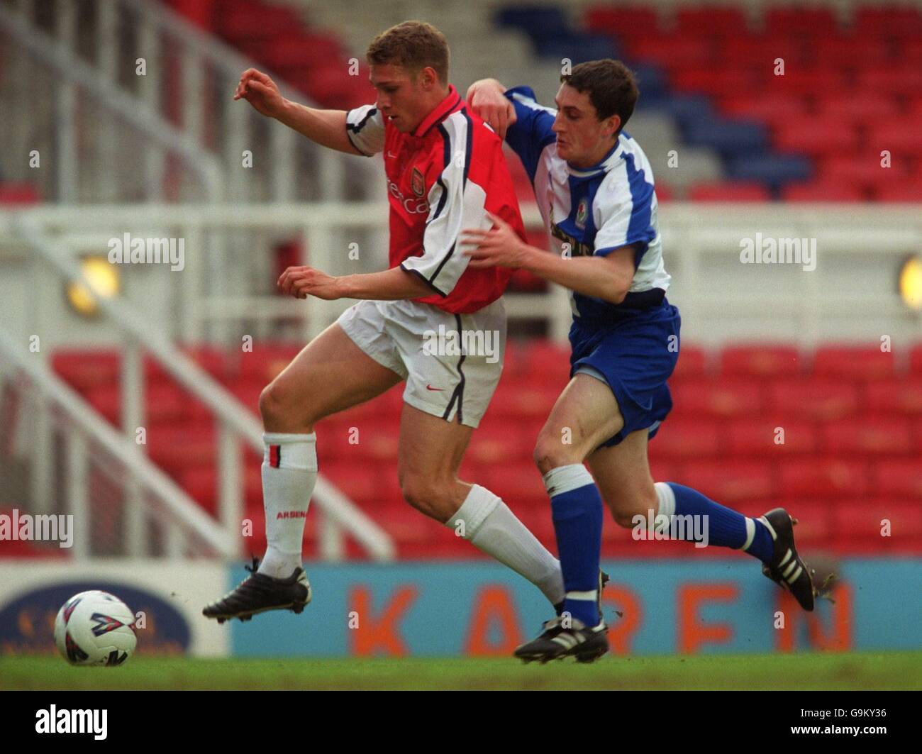 Arsenal's Moritz Volz and Blackburn Rovers' Robert Woodhead battle for ...