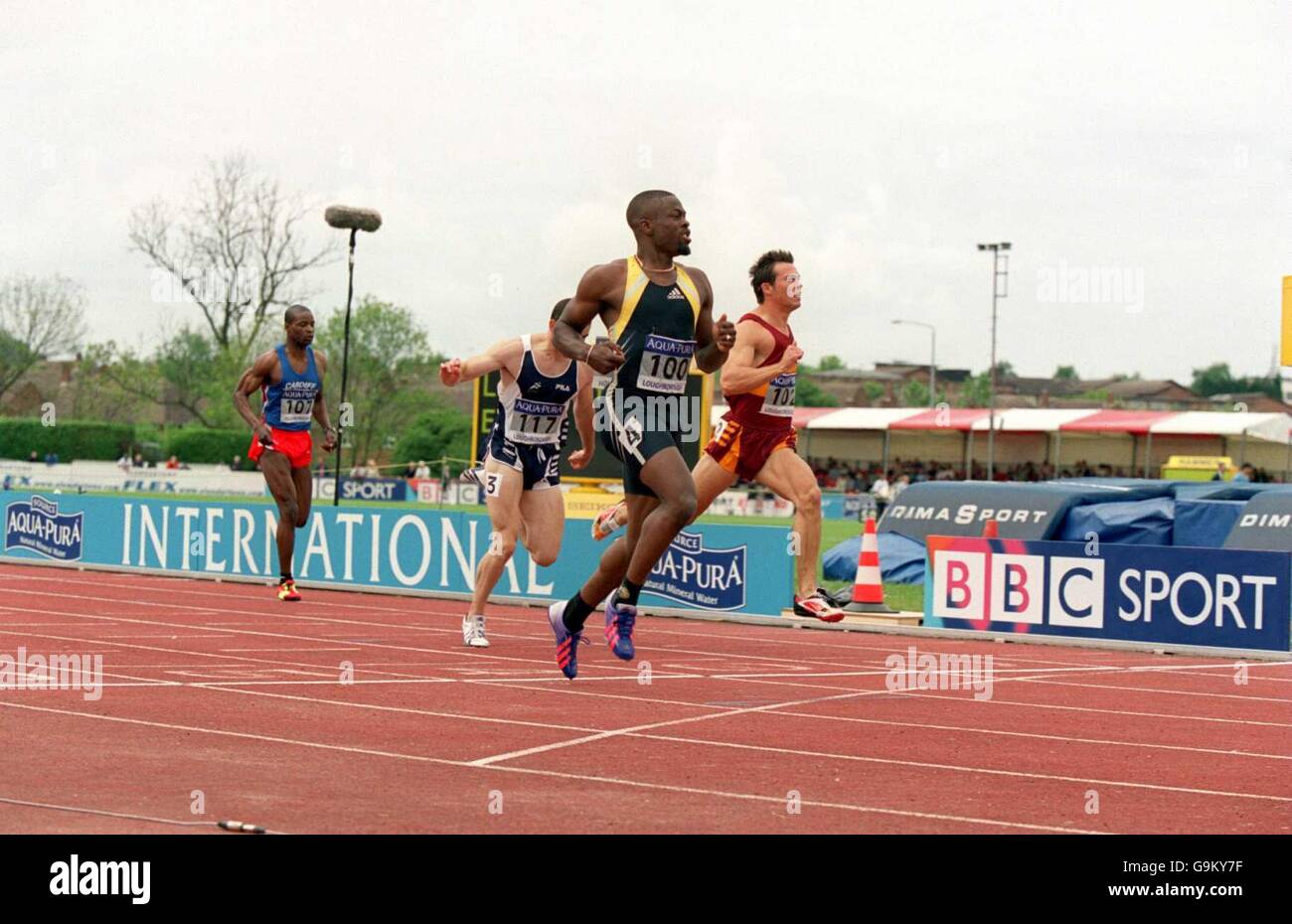 Jonathan Barbour (second r) comes home to win the Men's 200m Invitation ...