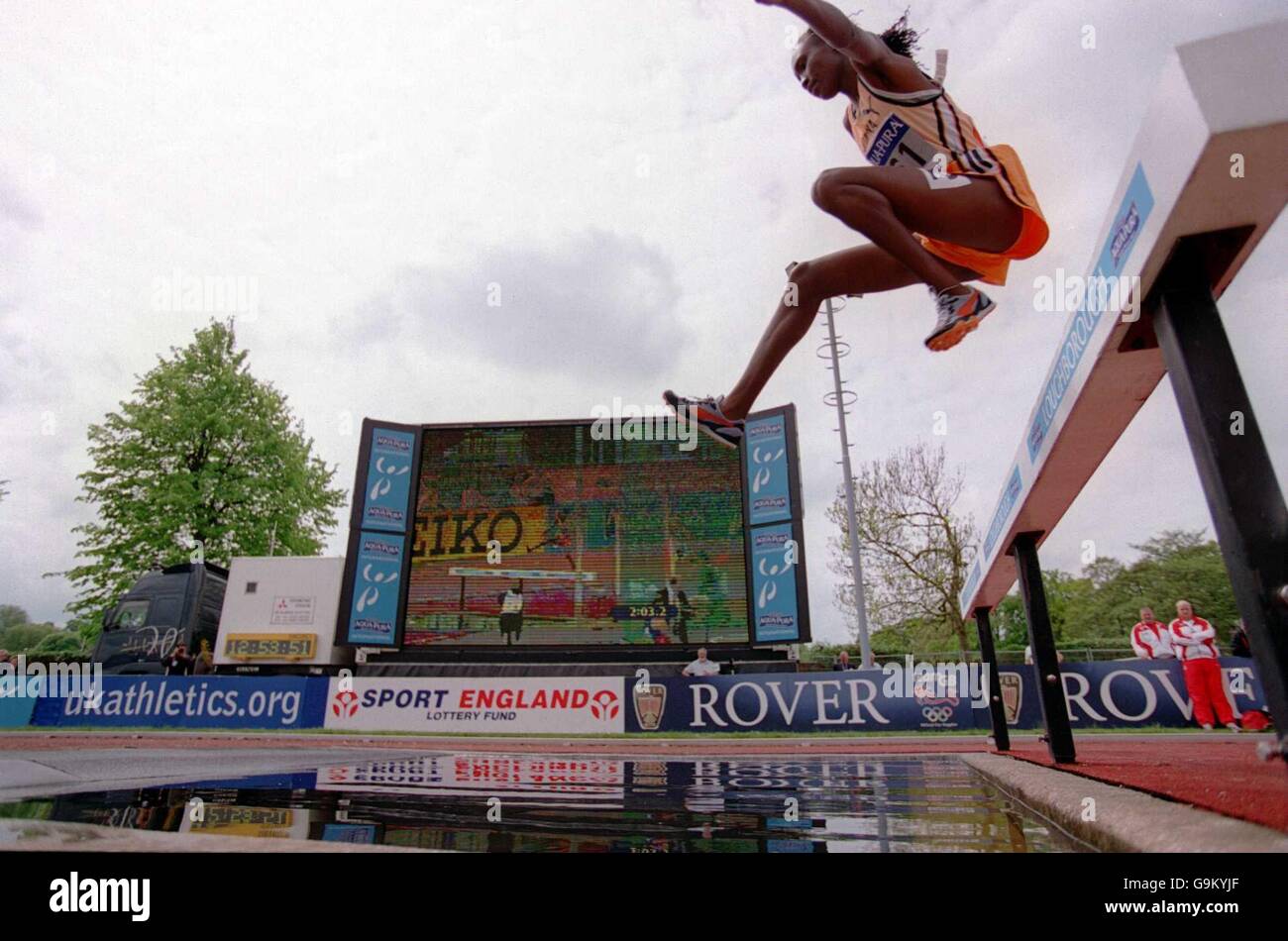 Kenya's Irene Limika leaps the water jump during the Women's 2000m ...