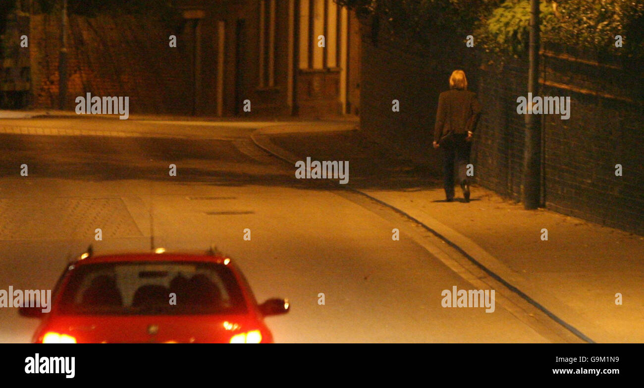 A prostitute walks in the red light area of Ipswich Stock Photo - Alamy
