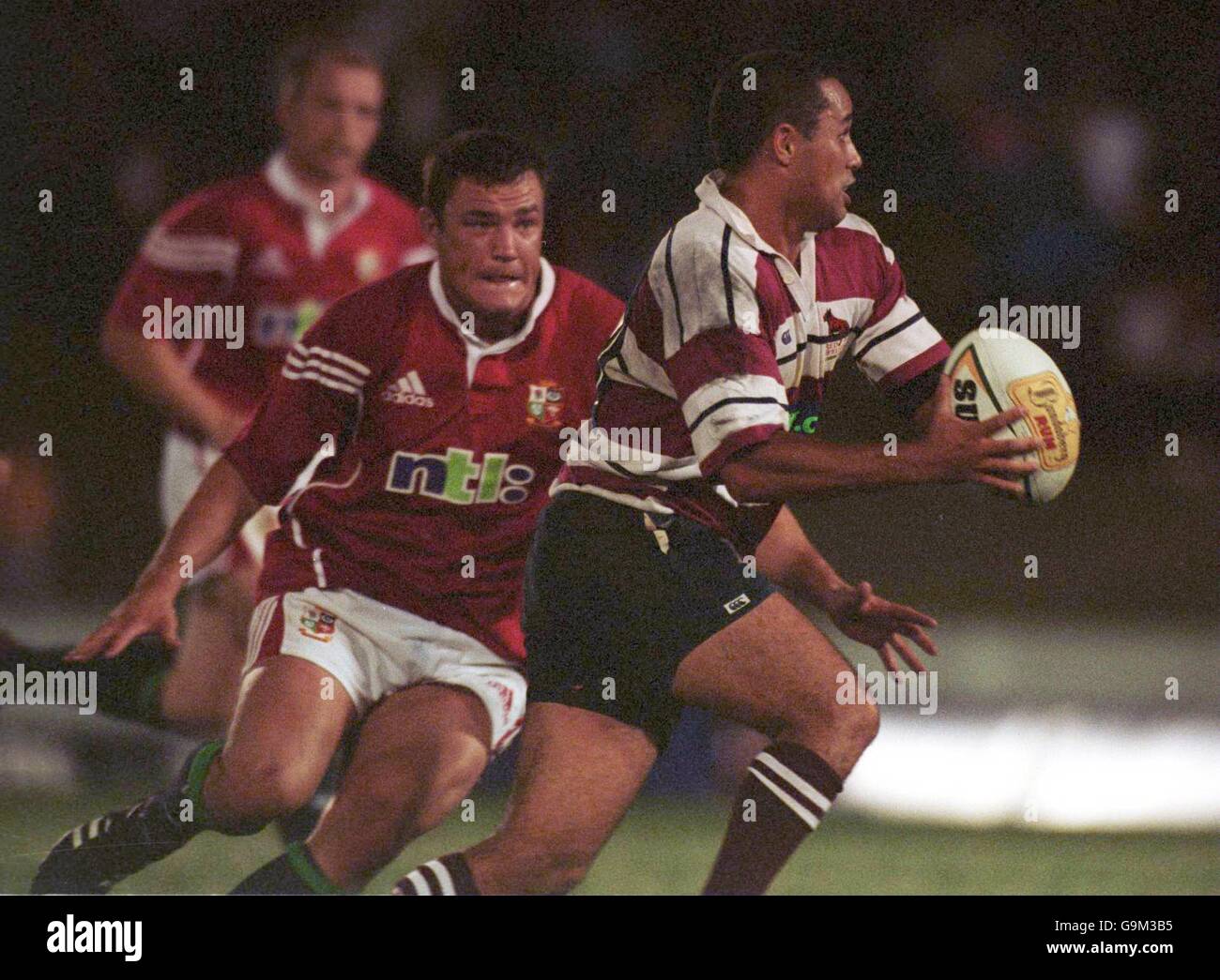 Queenslands Presidents XV Shane Drahm evades the tackle of British ...