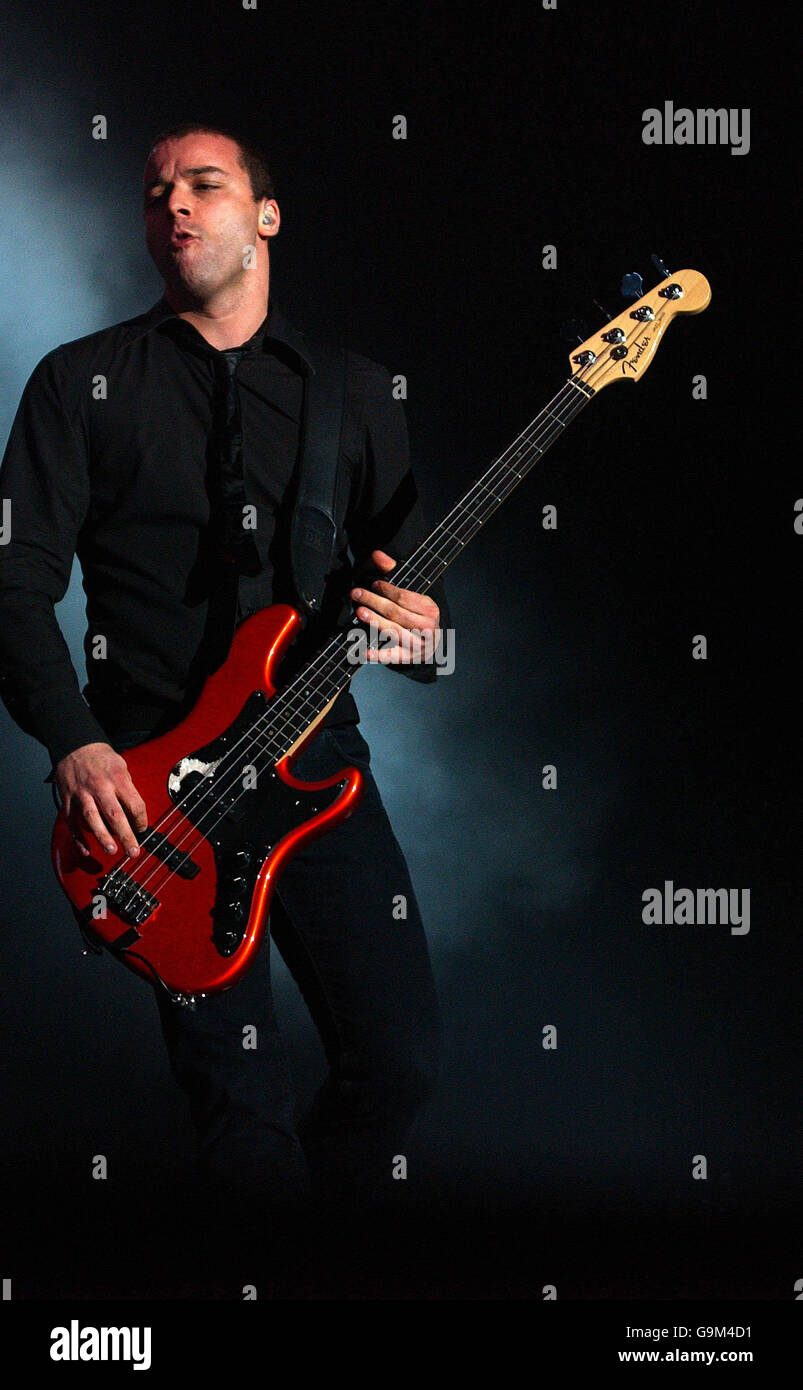 Muse bassist Chris Wolstenholme performs at Wembley Arena in west ...
