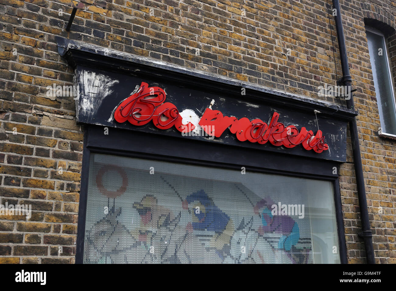 A decaying Bookmakers sign and betting shop window Stock Photo - Alamy