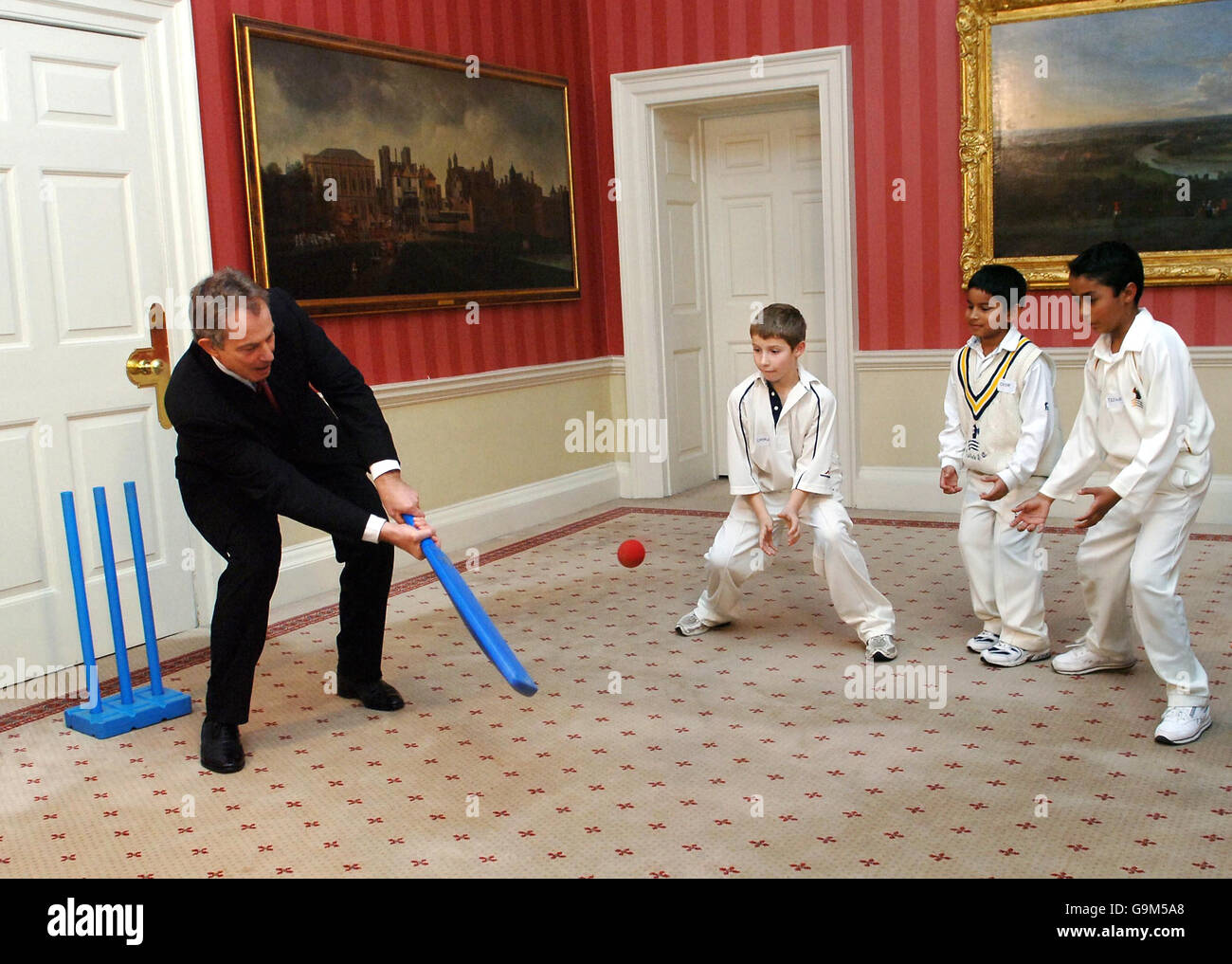 Prime Minister Tony Blair plays cricket in the hallway of No10 Downing ...