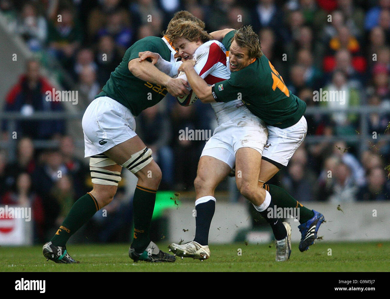 England's Matthew Tait is brought to a halt by South Africa's Wynard ...