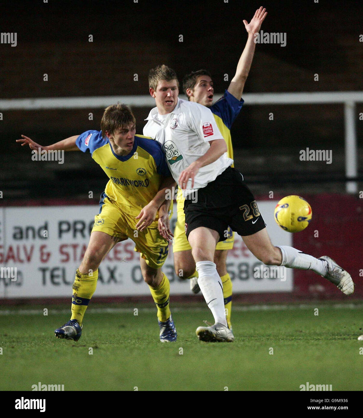 Hereford's Dean Beckwith (right) goes shoulder to shoulder with Torquay ...