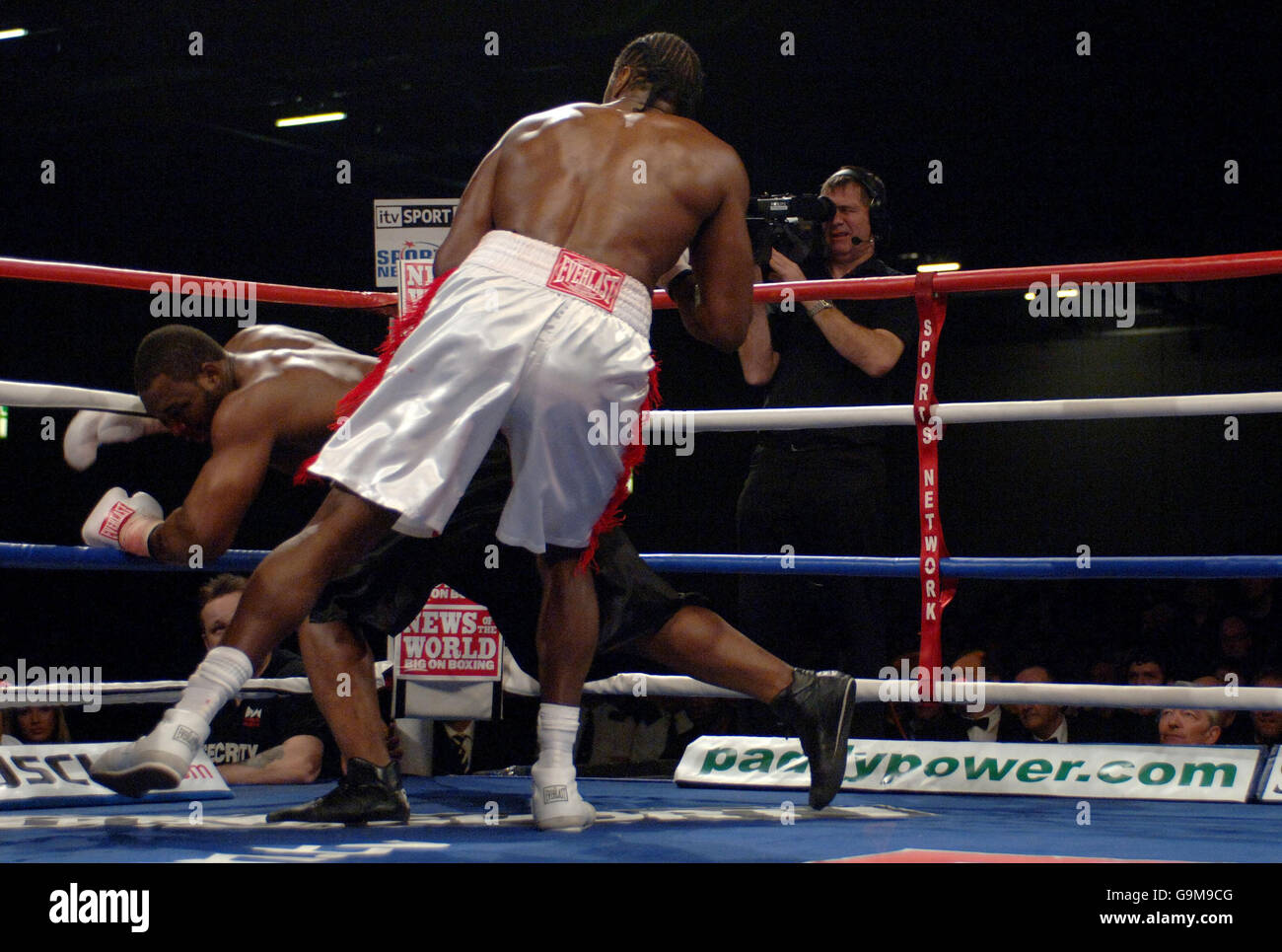 Full length back view defending punching mangrs hi-res stock ...