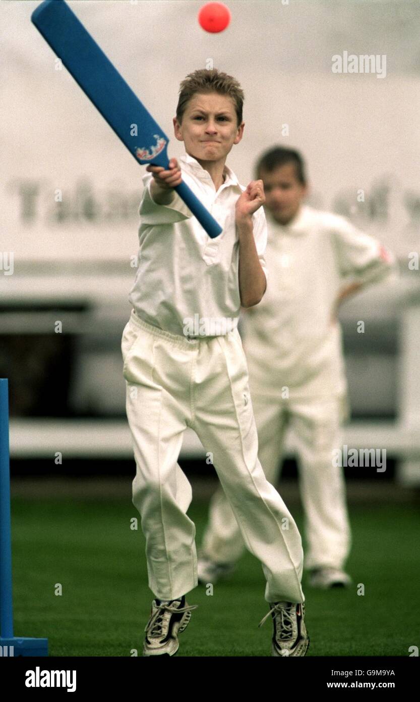 A youngster playing Kwik Cricket in an unorthodox style Stock Photo - Alamy