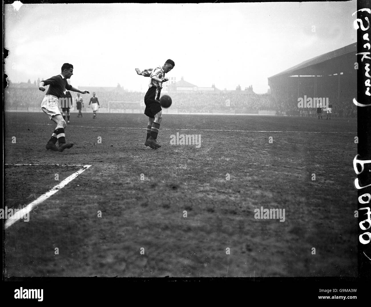 Brentford's Tom Cheetham (r) tries to control the ball, watched by ...