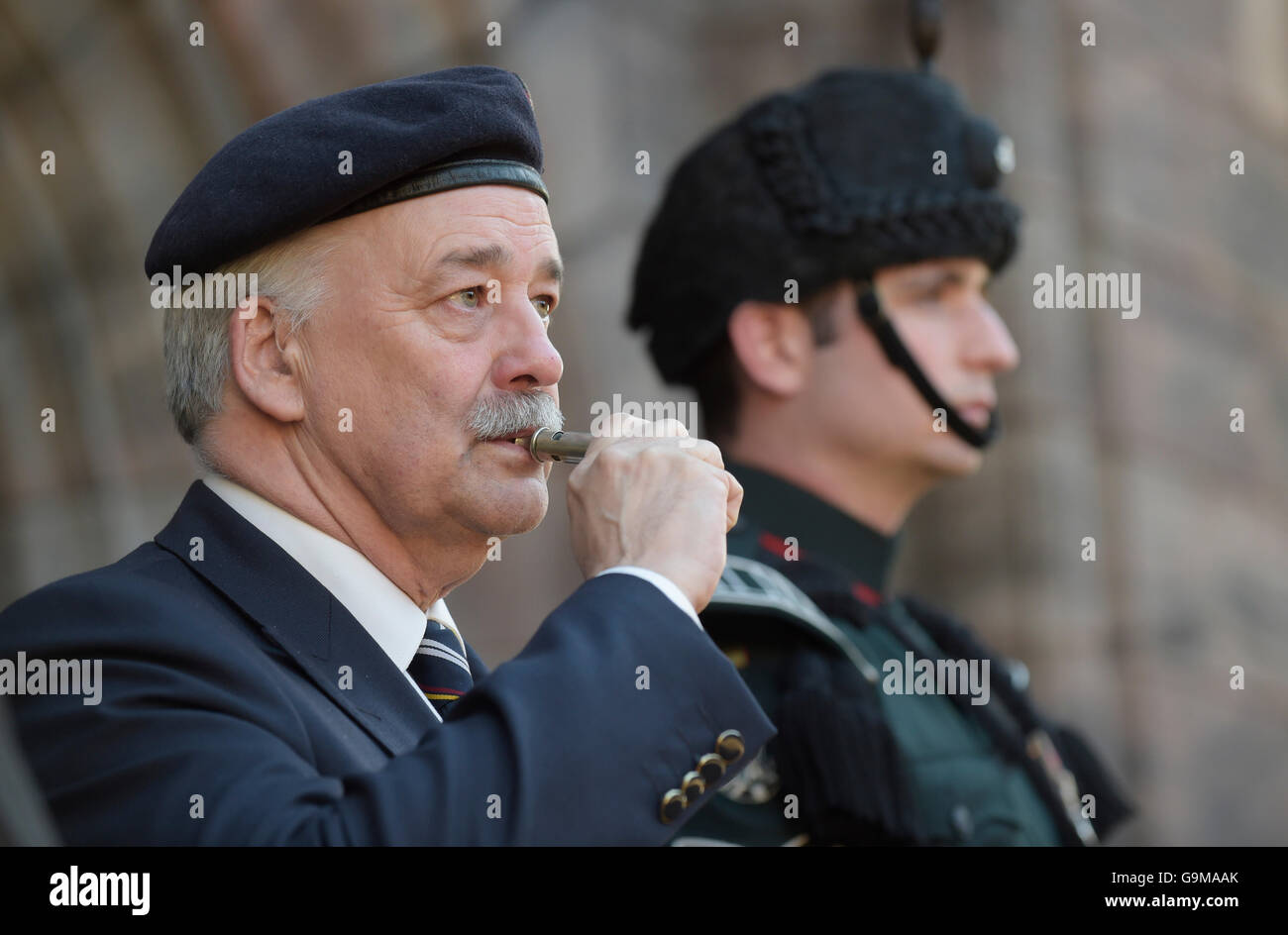 Alan Hamilton blows a whistle to signal the end of the two minute ...