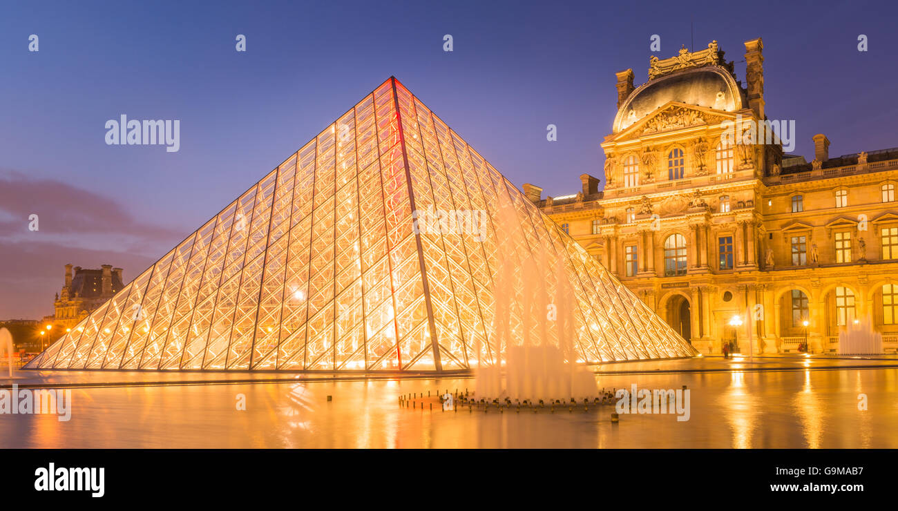 Evening view of Glass Pyramid at the famous Museum Louvre Stock Photo ...
