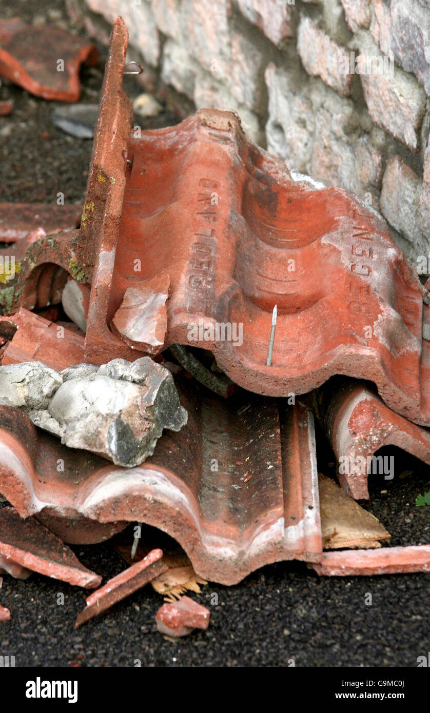 Damaged roof tiles hi-res stock photography and images - Alamy