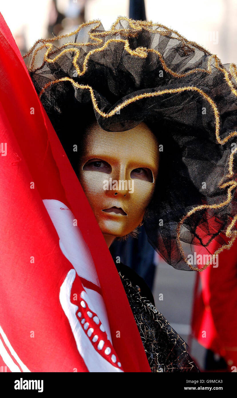 A mask-wearing dancer takes part in the New Year's Day Parade in ...